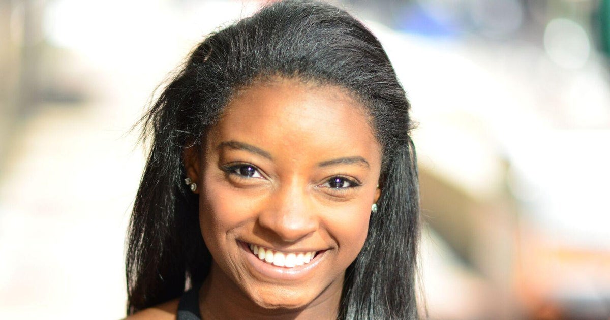 Simone Biles extends helping hand to other U.S. foster kids - CBS News