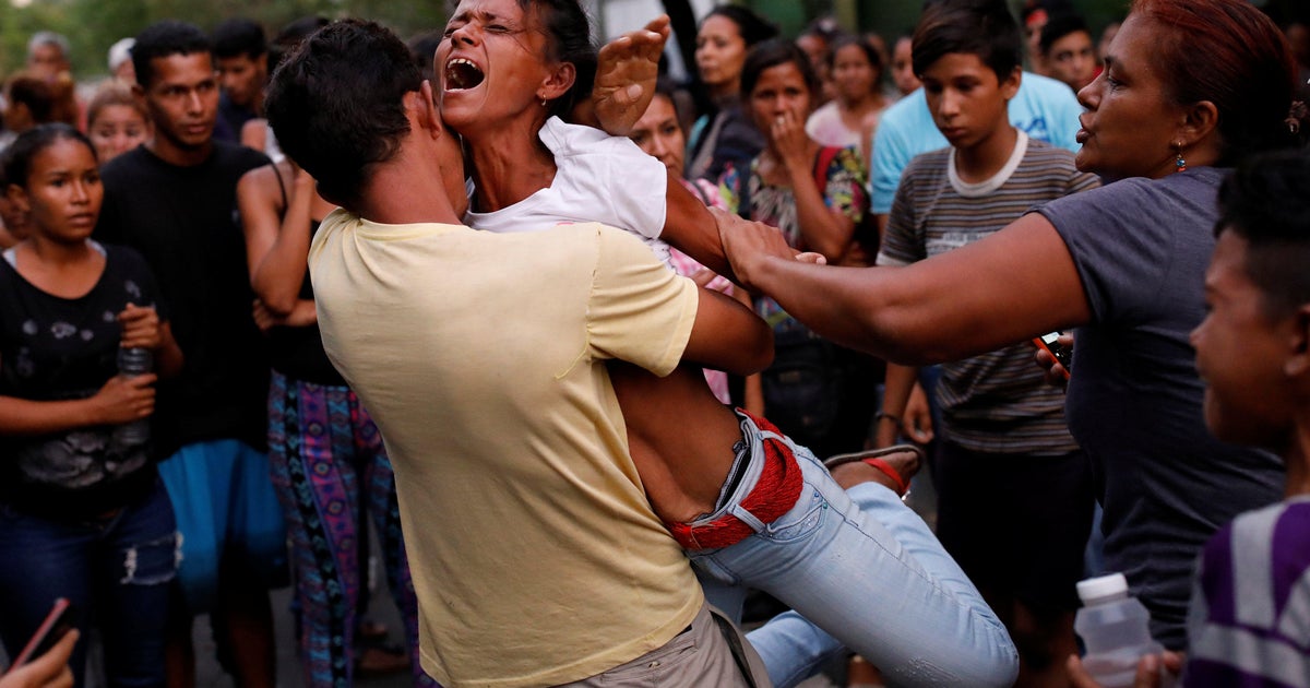 At least 68 dead as fire sweeps through Venezuela police station cell ...