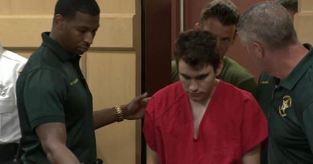 Parkland shooting survivor and his family file lawsuit - CBS News