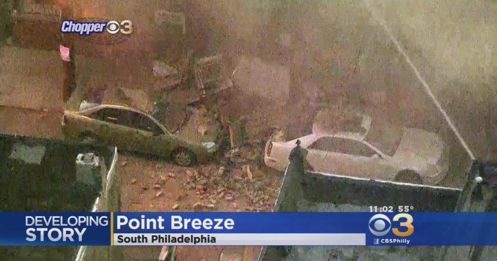 Philadelphia house explosion: Father, son survive collapse - CBS News