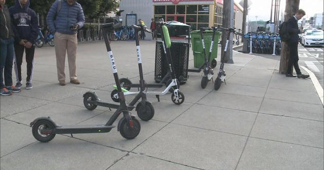 Dockless bike shares and scooters litter city streets - CBS News
