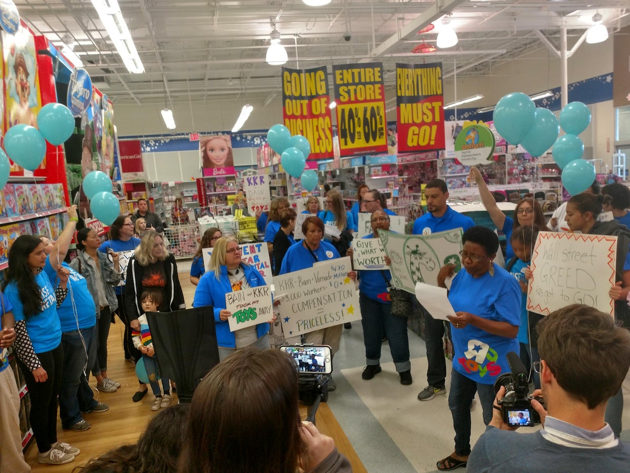 Toys "R" Us workers take pay demands to Wall Street - CBS News