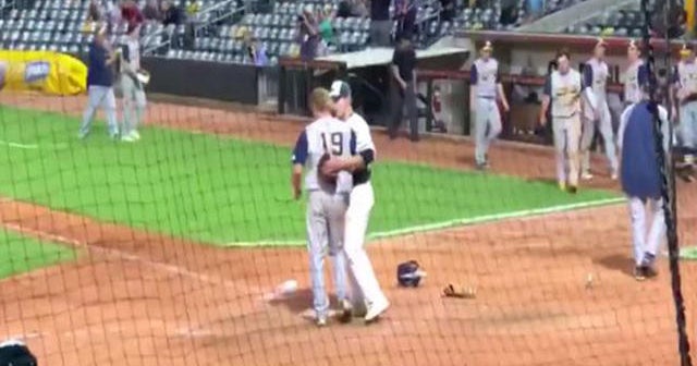 Baseball player hugs childhood friend on the losing team - CBS News