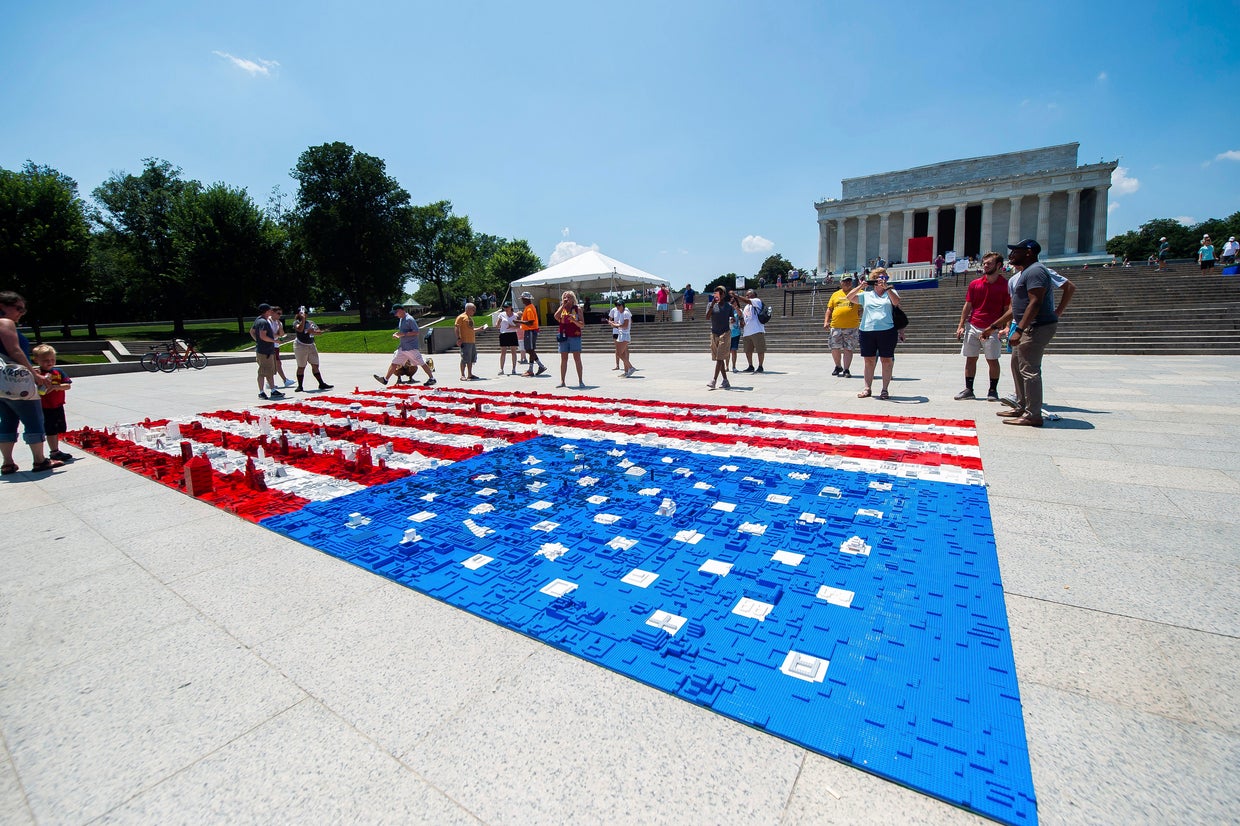 Visitors build giant American flag out of LEGO bricks on the National ...