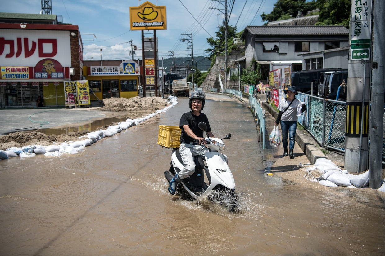 Flooding in Japan 2018: Thousands without power as rescuers search for ...
