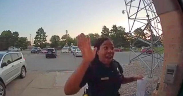 Police officer caught singing and dancing on surveillance camera - CBS News