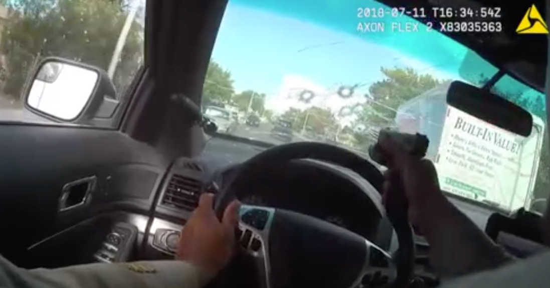 Police officer shoots through his cruiser's windshield during high ...