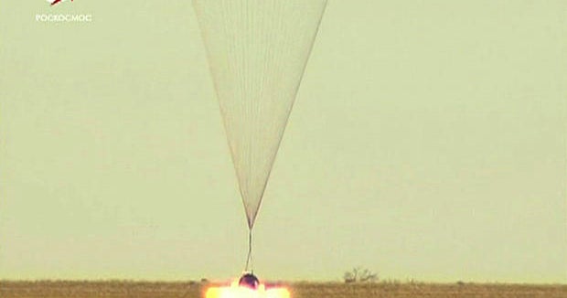 Soyuz capsule brings three station fliers back to Earth after 6 months ...
