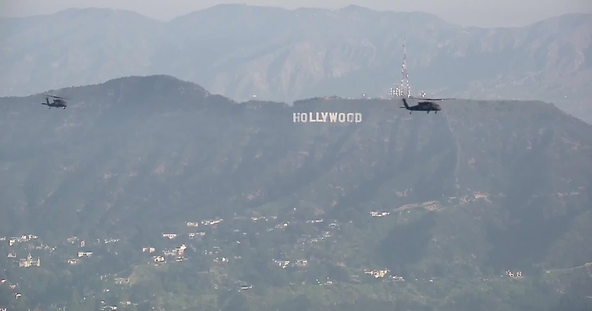 Apache, Blackhawk Helicopters Fly Past Hollywood Sign On Refuel Trip ...
