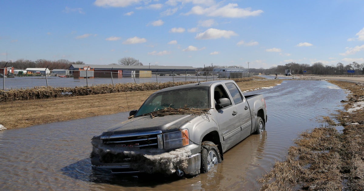 Residents rescued amid historic flooding across Midwest - CBS News