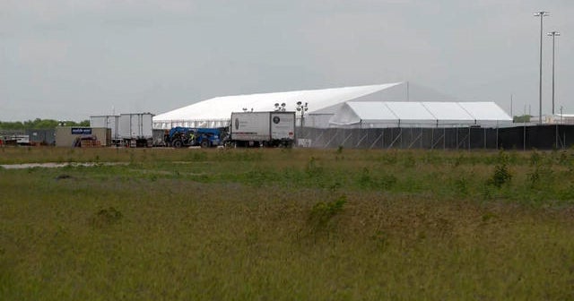 New tent cities housing migrants at southern border - CBS News
