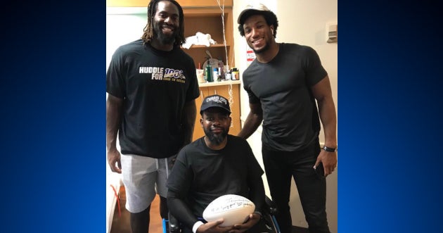 Ravens Players Pay Surprise Visit To BPD Sgt. Isaac Carrington - CBS ...