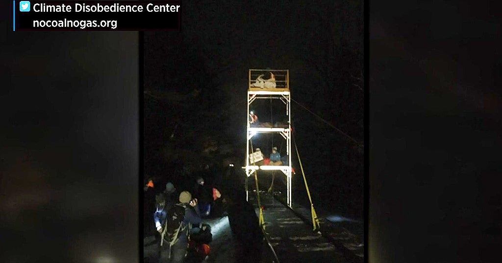 4 Arrested After Protesters Use Scaffolding To Block Train Carrying ...