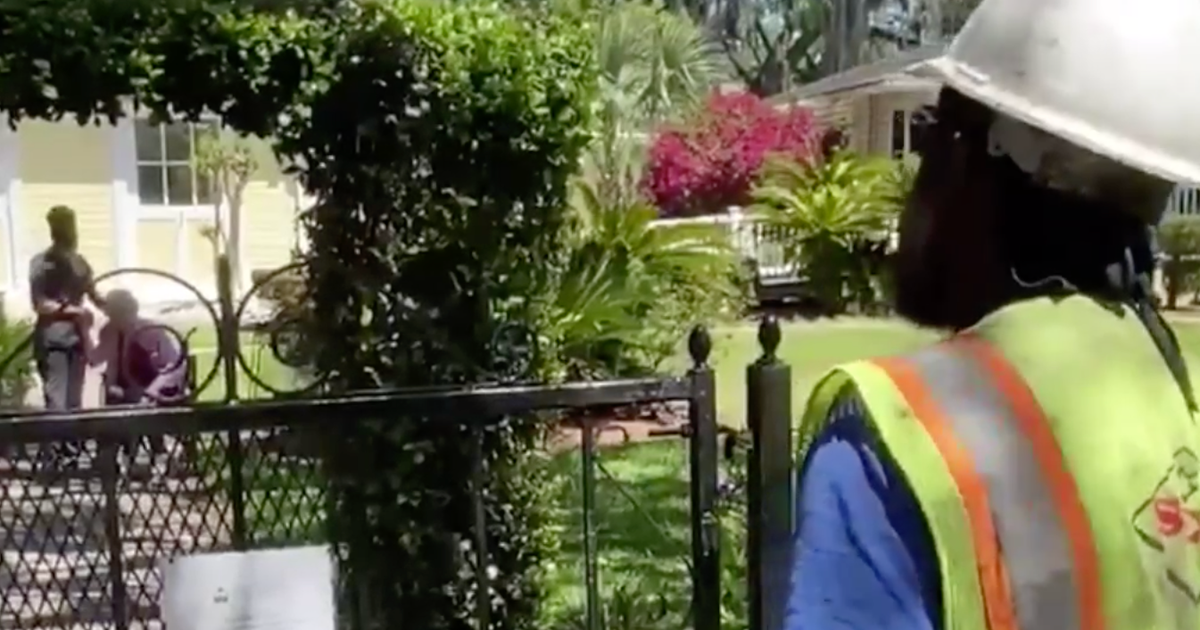 Utility worker gives impromptu performance to elderly woman sitting ...