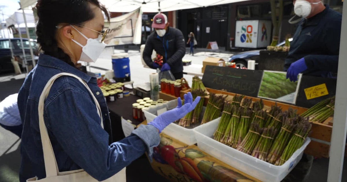 A Seattle farmers market reopens - CBS News