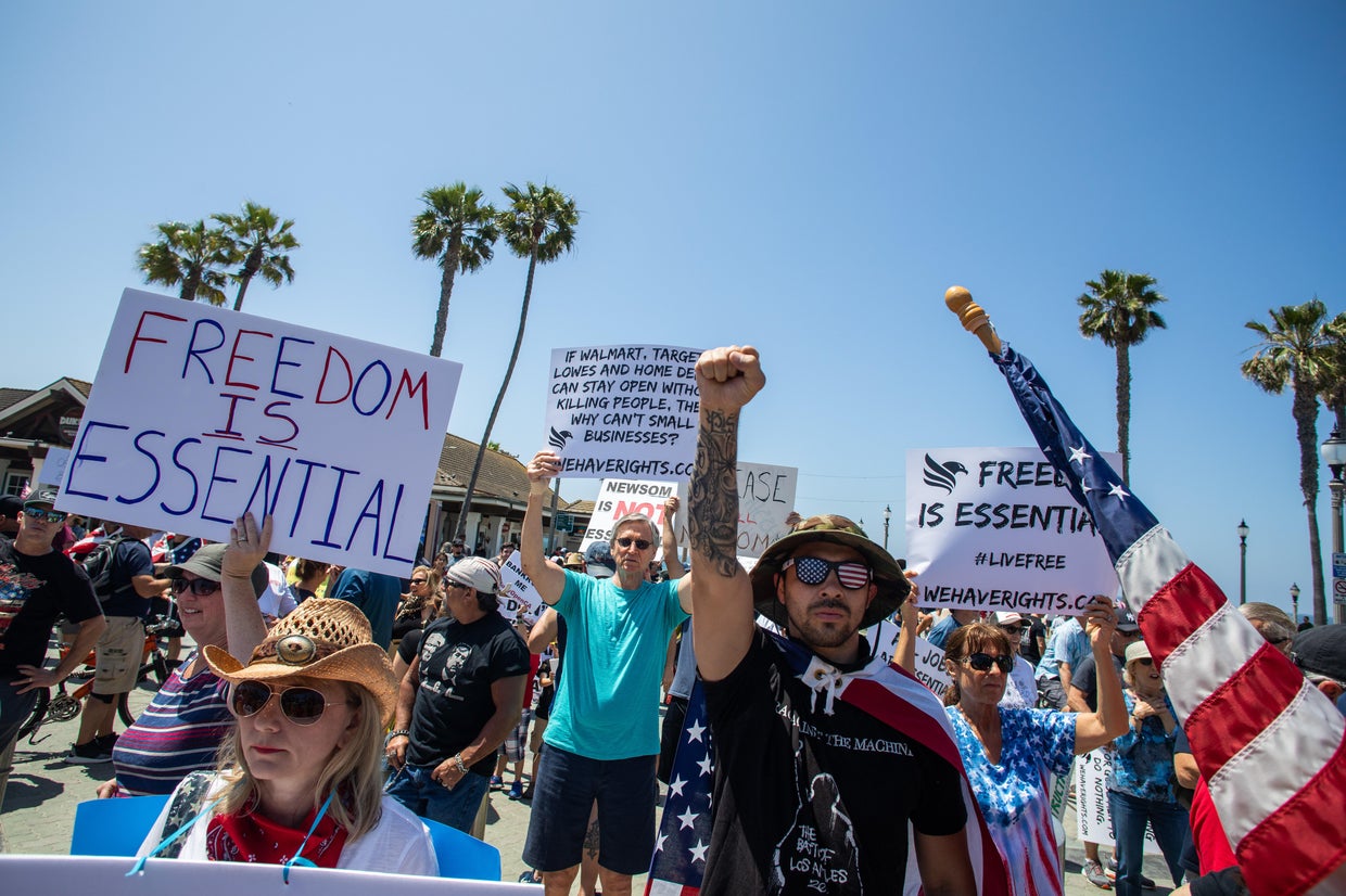 Thousands of people storm California beaches to protest closures - CBS News