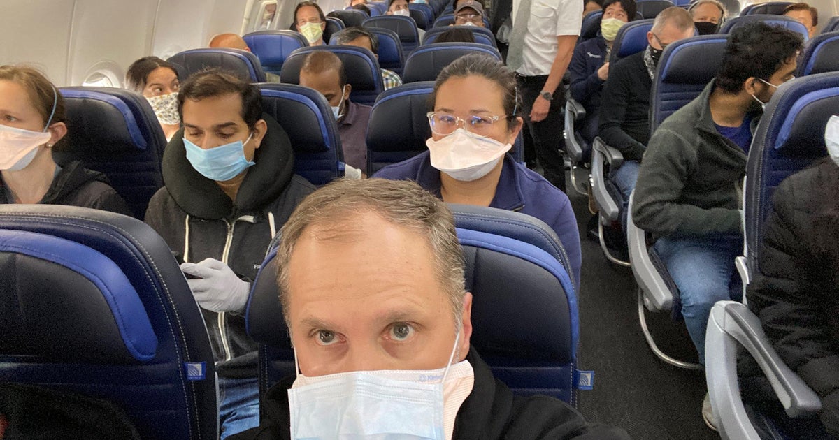 United Airlines offering passengers face masks and hand sanitizer wipes ...