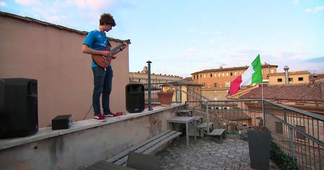 When a balcony is a stage - CBS News