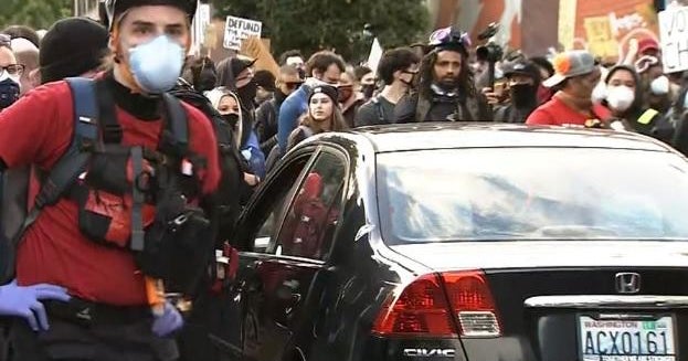 Man drives car toward Seattle protesters then shoots one, police say ...