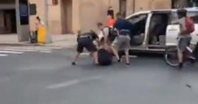 Lawmaker calls video of plainclothes officers bundling teen into ...