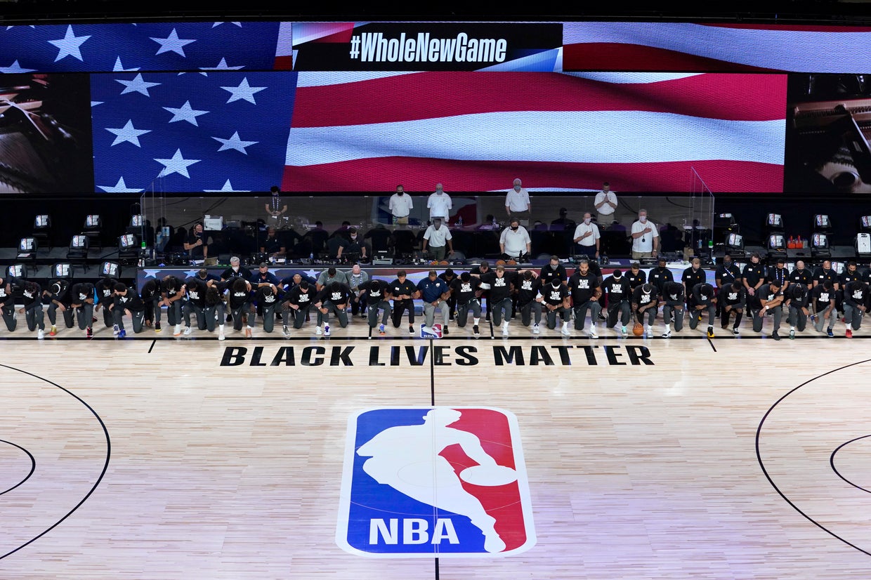 NBA players and coaches kneel during national anthem as season restarts ...