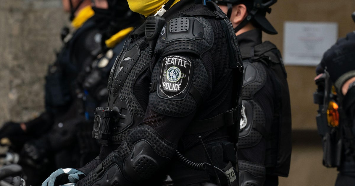 Seattle cop placed on leave after video appears to show him walking ...