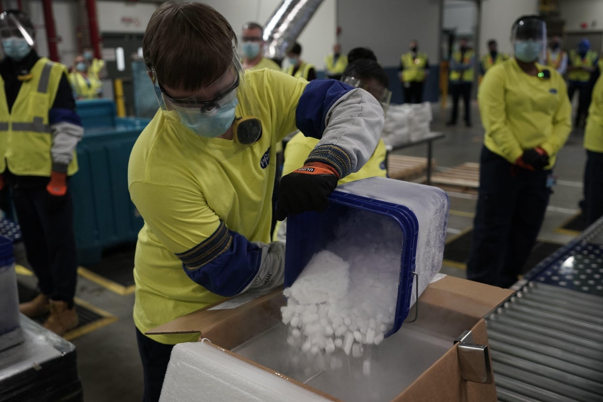 COVID vaccine distribution underway as first trucks hit the road - CBS News