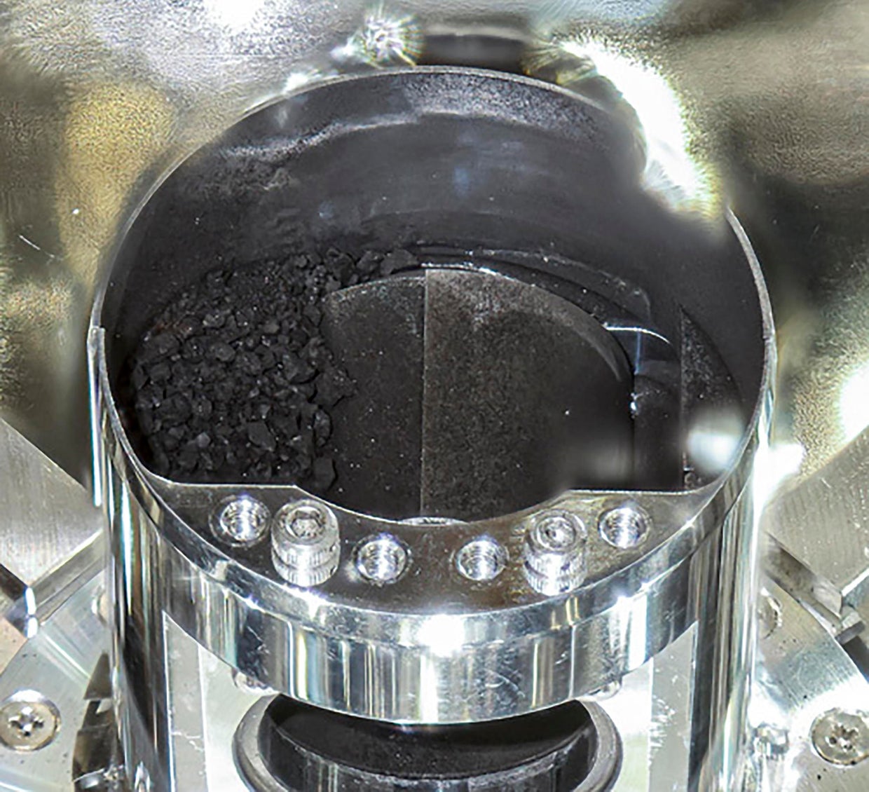 Asteroid chips that look like charcoal sent back to Earth by Japanese ...