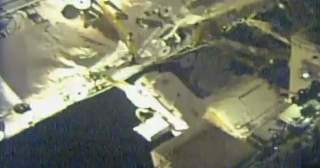 Two NASA astronauts conduct spacewalk - CBS News