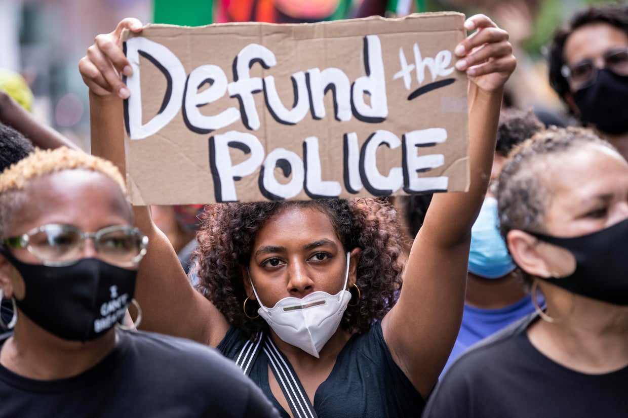 "Defund the police" made headlines. What does it look like now? - CBS News