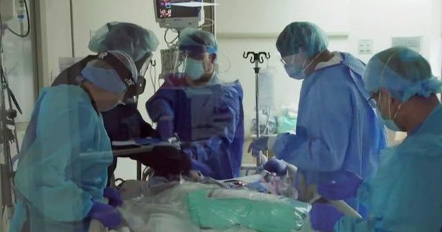 Hospital copes with pandemic one year later - CBS News