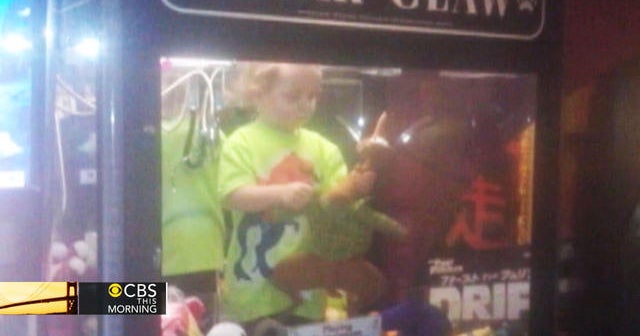Boy gets stuck inside claw crane vending machine - CBS News