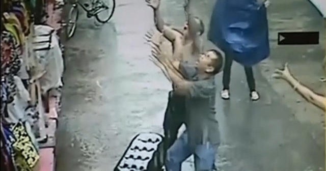 Man catches falling baby - CBS News