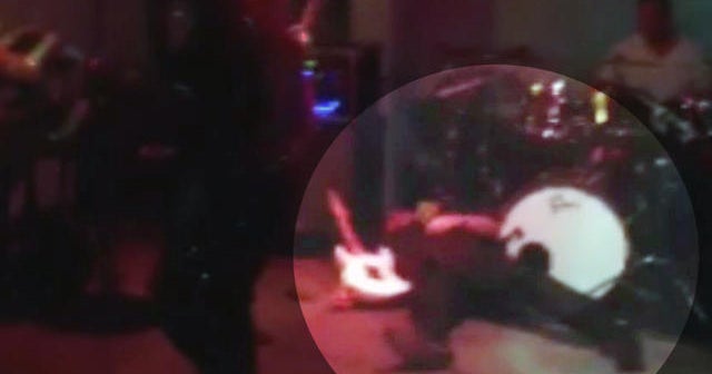 Nurse saves guitarist's life after on-stage collapse - CBS News