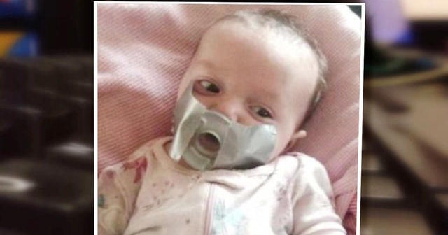 Grandma tapes pacifier to baby - CBS News