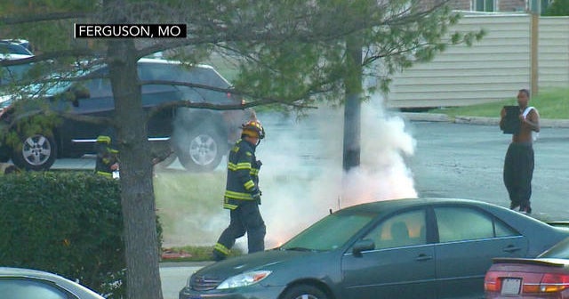 New protests flare again in Ferguson after memorial burning - CBS News