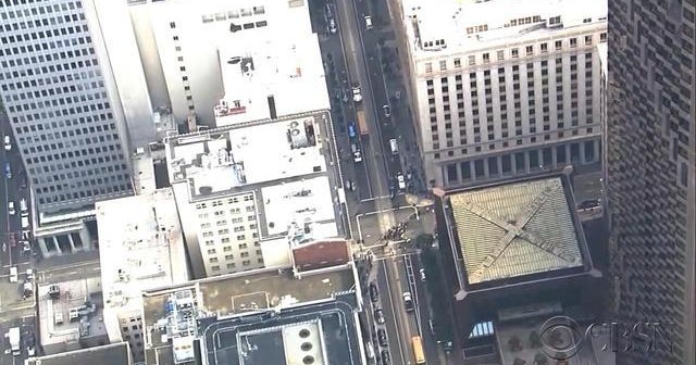 Man survives fall from building onto car in S.F. - CBS News