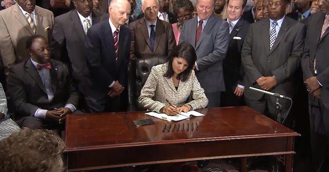 Gov. Nikki Haley signs bill to take down Confederate flag - CBS News