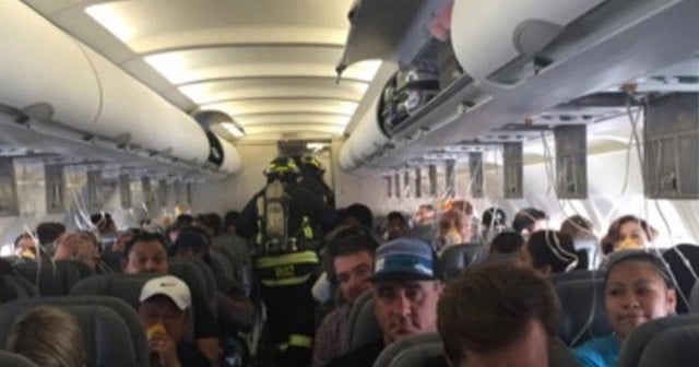 Mysterious illness strikes passengers on United flight - CBS News