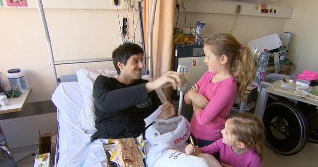 Brussels bombings survivor reunites with daughters - CBS News