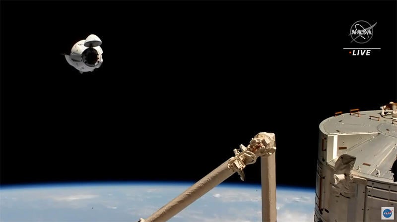 SpaceX Crew Dragon caps flawless rendezvous with station docking - CBS News