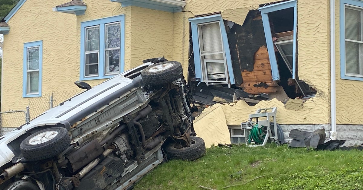 Car Rams Into House After Armed Carjacking, Two Arrested - CBS Minnesota