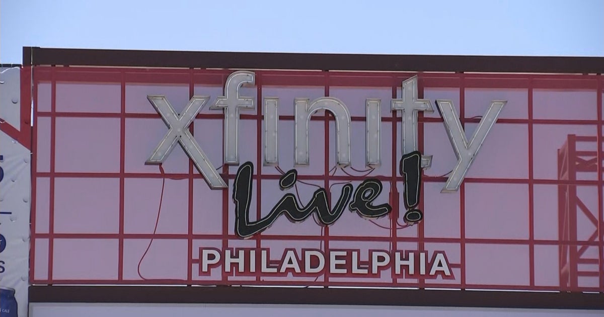 Woman found unresponsive hanging from gate outside Xfinity Live! in ...