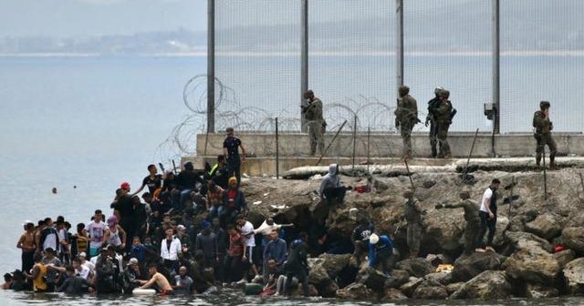 WorldView: Migrants inundate Spanish enclave; Indian navy searches for ...
