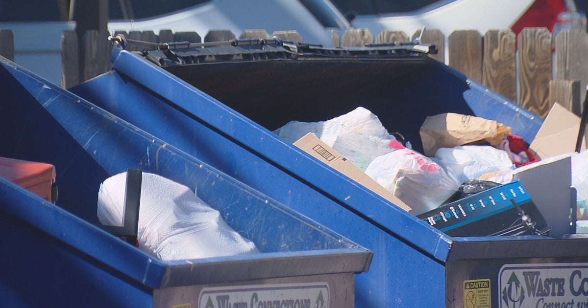 Man Rummaging Through Denver Apartment Dumpster Shot - CBS Colorado