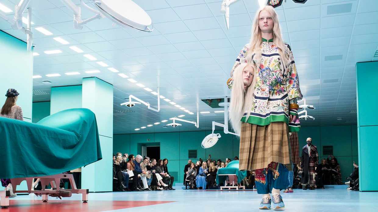 Why Gucci models carried fake heads down the runway - CBS News