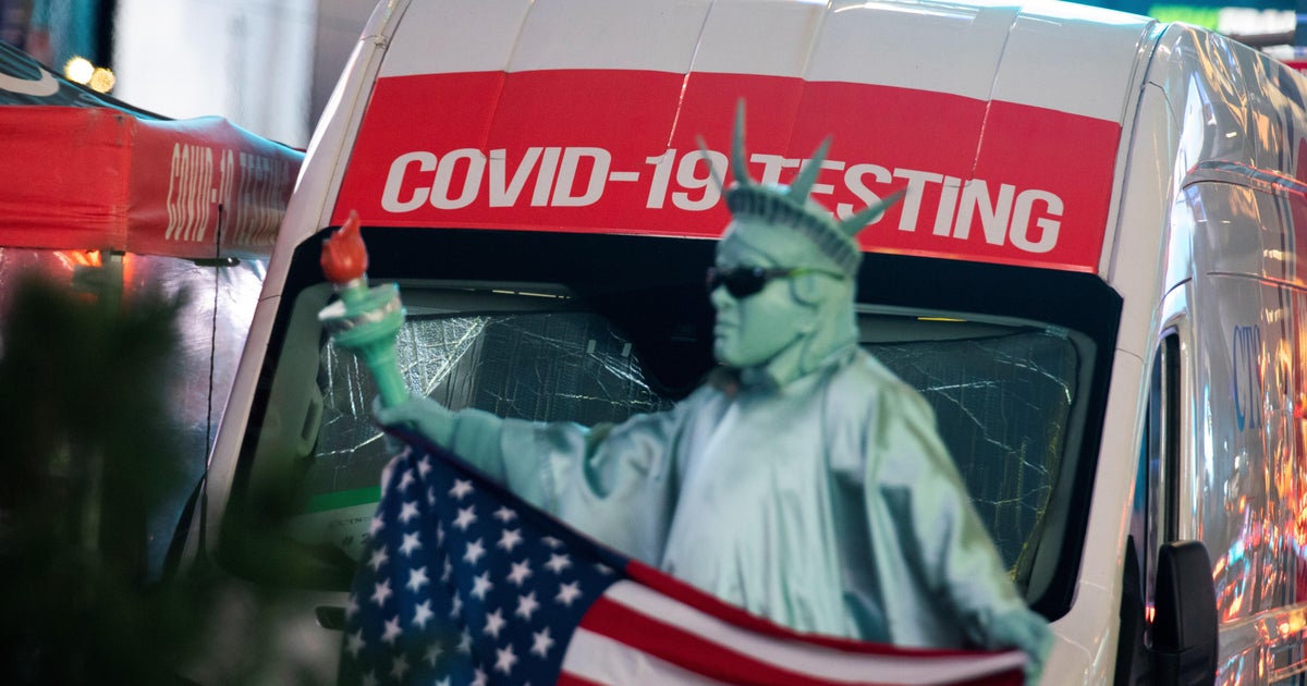 Essential workers slammed again as Omicron variant spreads - CBS News