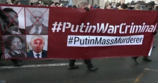 Ukrainians take to the streets for anti-war protest - CBS News