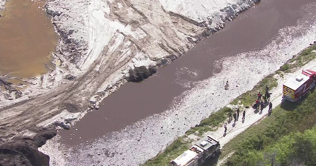 Body Pulled From Water After Dump Truck Goes Into Parkland Canal - CBS ...