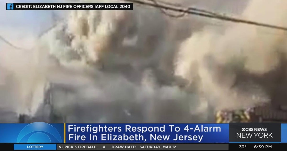 Firefighters battle 4-alarm multi-house blaze in Elizabeth, N.J. - CBS ...